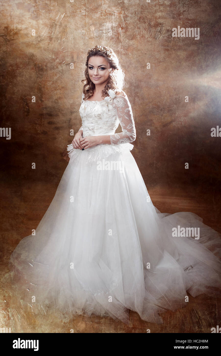 Beautiful girl bride in luxurious wedding dress. Portrait in profile ...