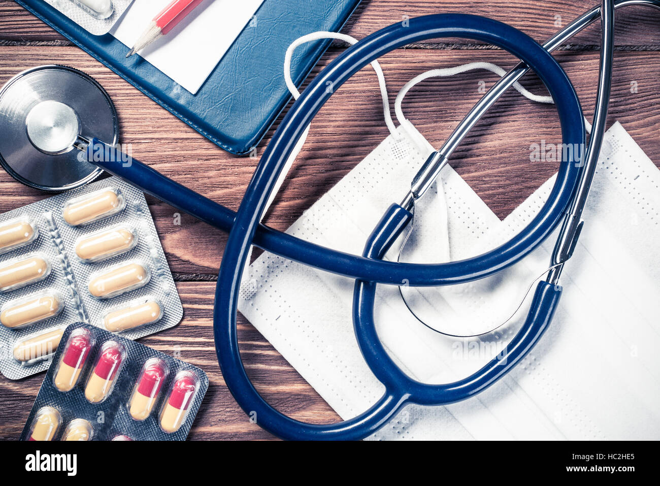 Desk of doctor with medicine things Stock Photo - Alamy
