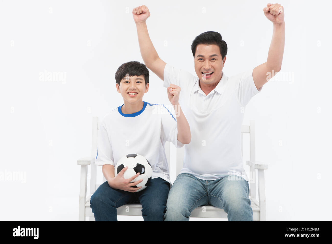 Father and son smiling, soccer ball hi-res stock photography and images ...