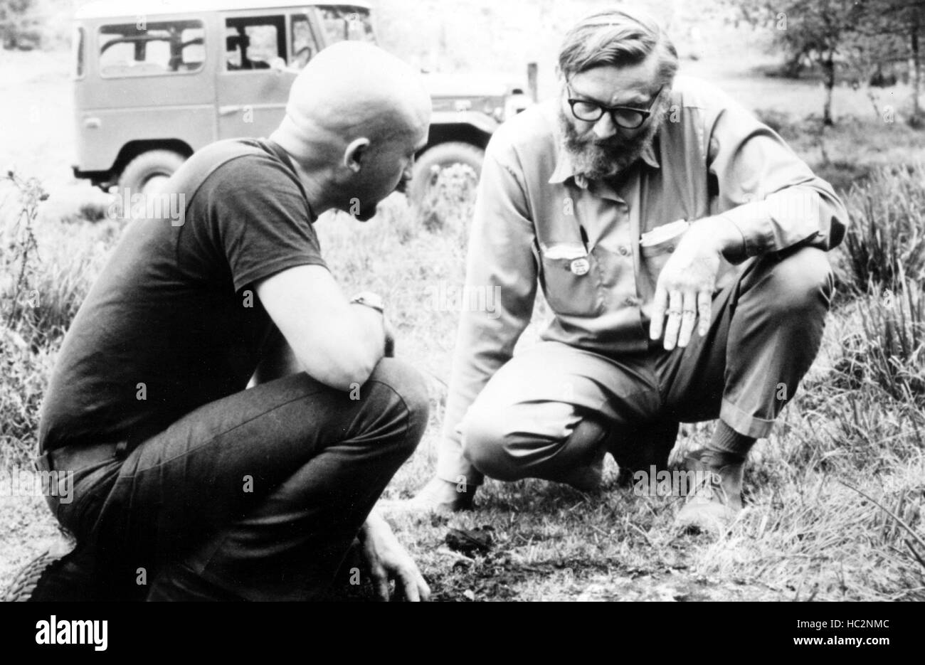 THE MYSTERIOUS MONSTERS, anthropologist Grover Krantz (right), examines ...