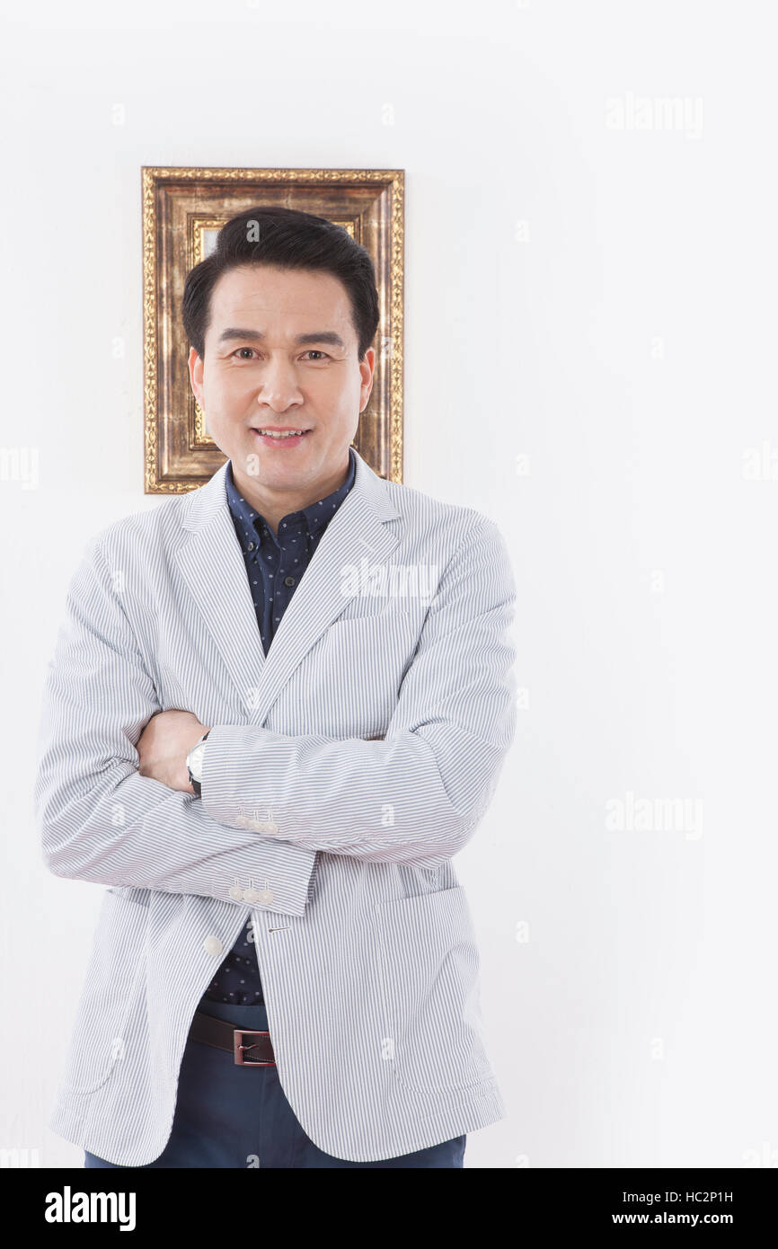 Man folding his arms hi-res stock photography and images - Alamy