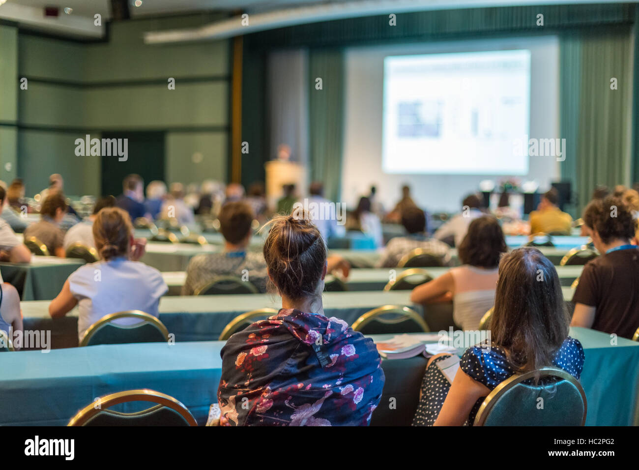 Audience in lecture hall participating at business conference Stock ...