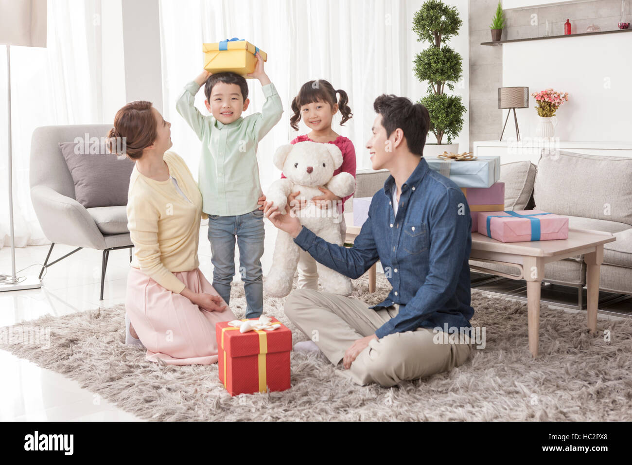 Harmonious family in living room hi-res stock photography and images ...