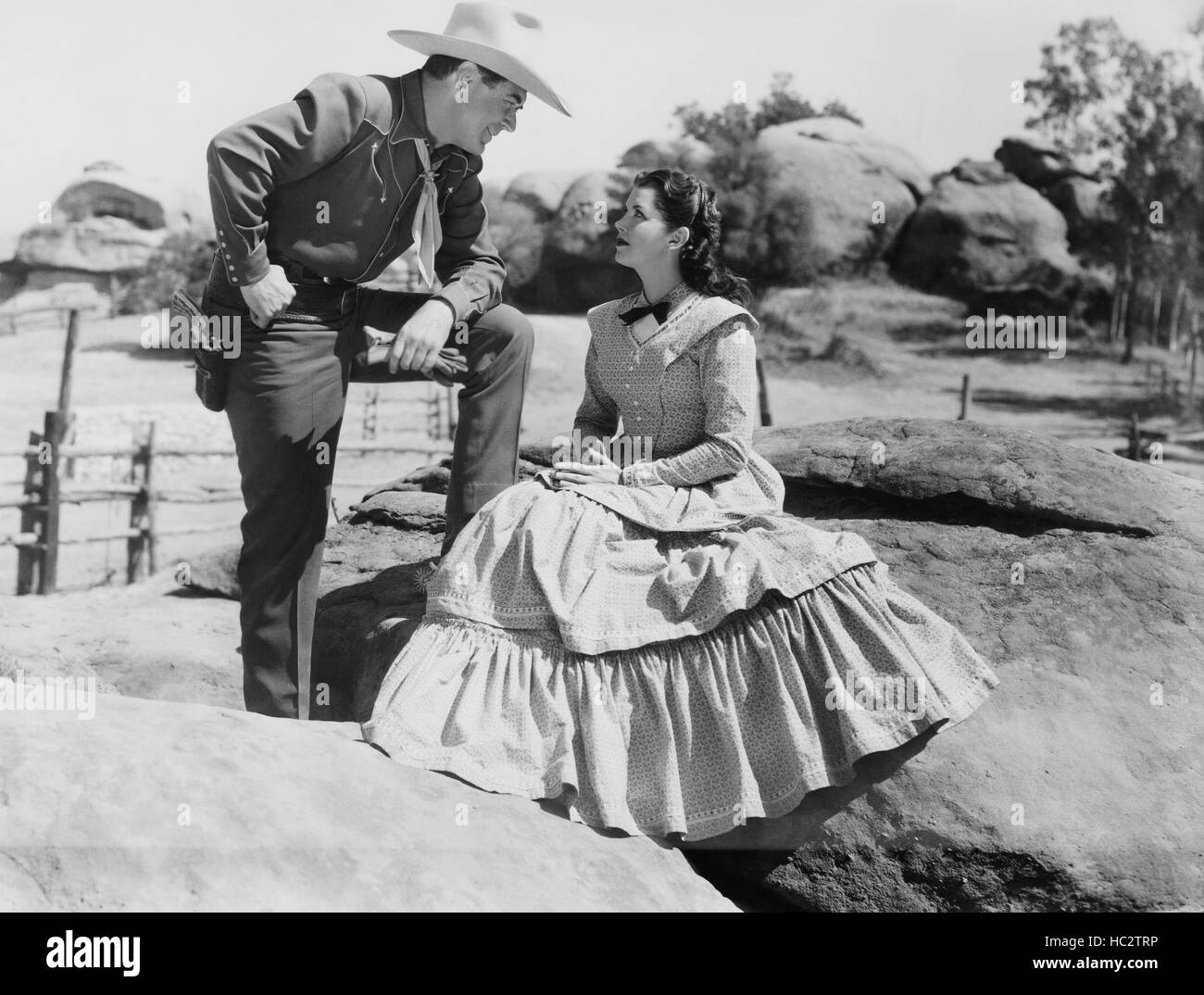 OUTLAW GOLD, from left: Johnny Mack Brown, Jane Adams, 1950 Stock Photo ...