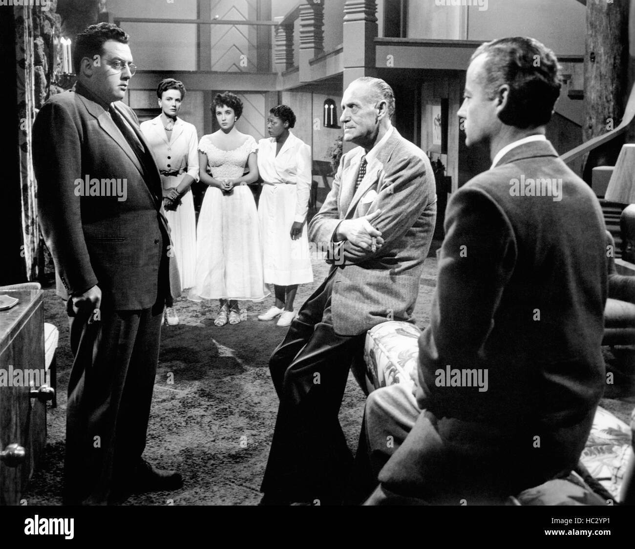 A PLACE IN THE SUN, foreground: Raymond Burr, Herbert Heyes, Shepperd Strudwick; background ...