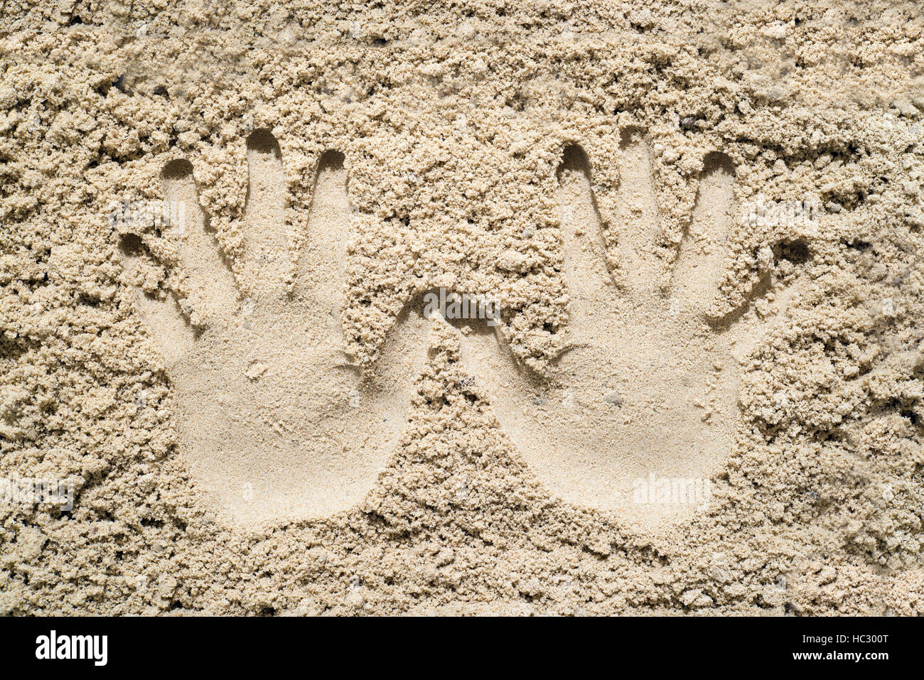 hand prints on the sand Stock Photo - Alamy