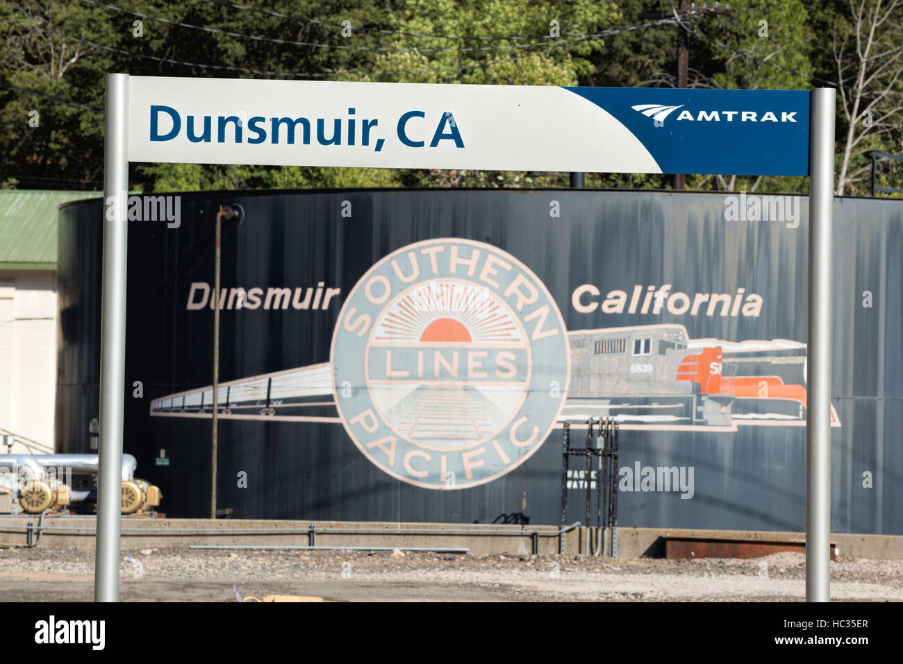 Amtrak station sign and an above ground fuel storage tank in the rail ...
