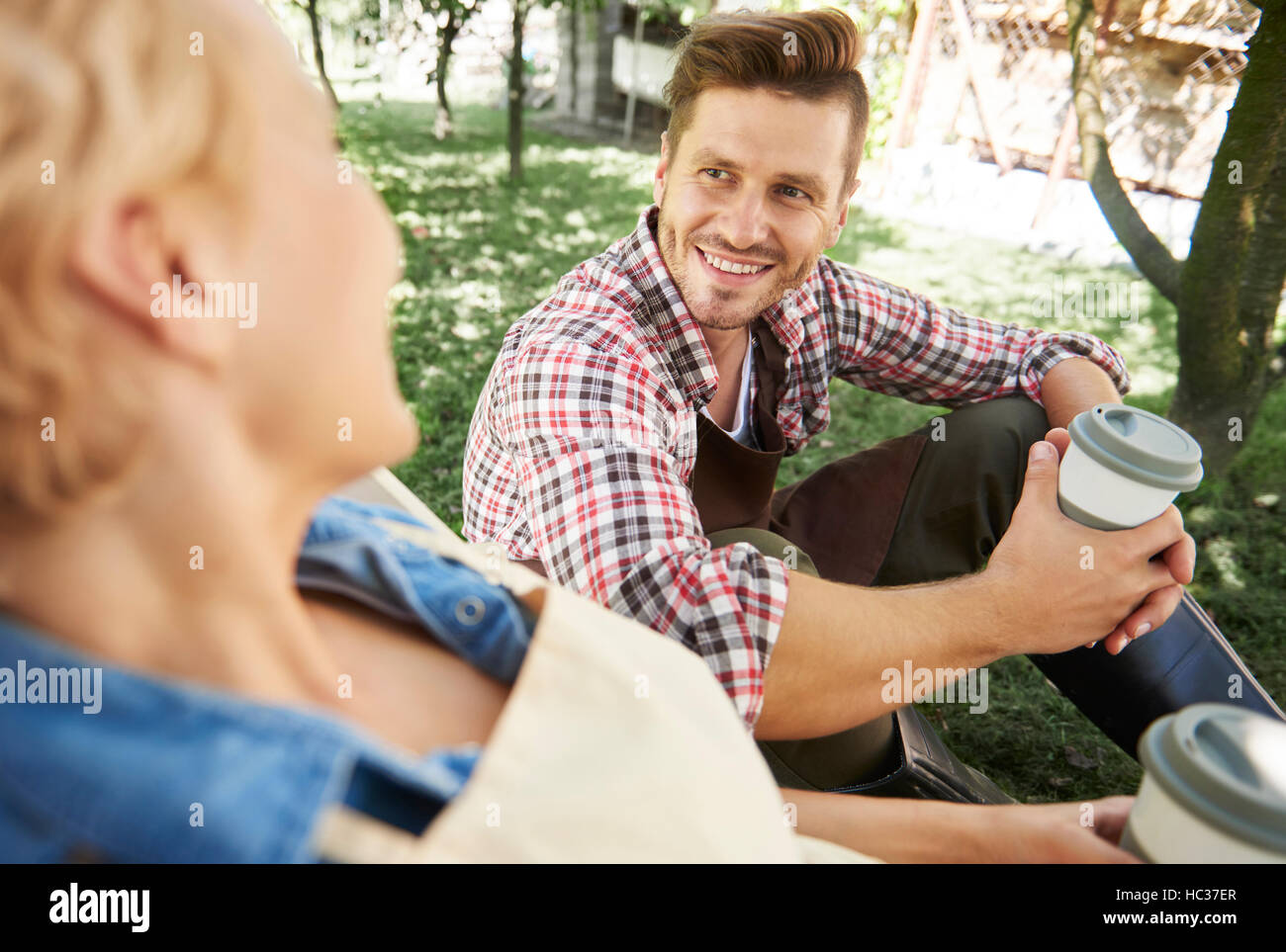 Coffee time in garden sitting under tree Stock Photo - Alamy