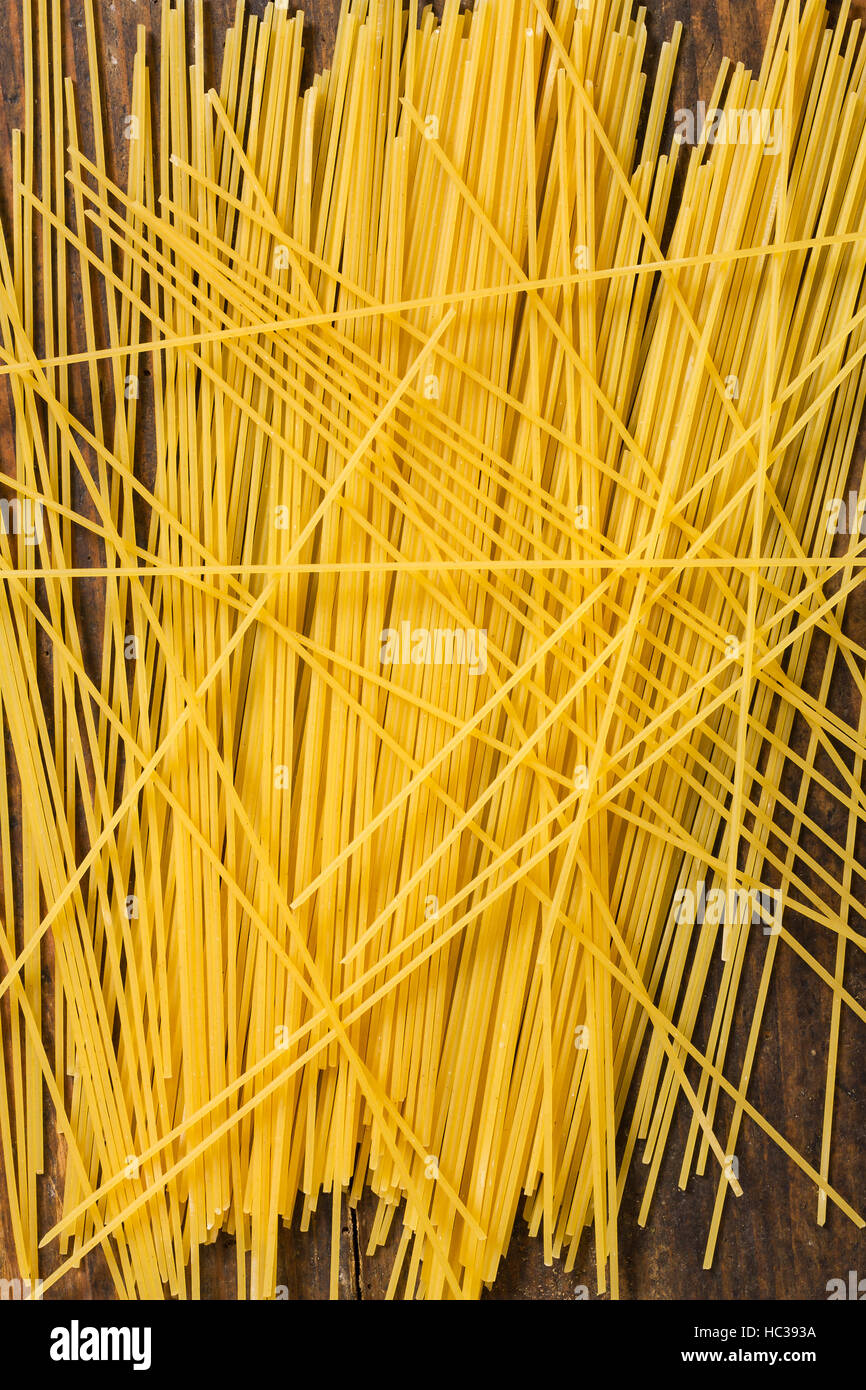 Italian pasta, yellow spaghetti, as close up top view still life ...