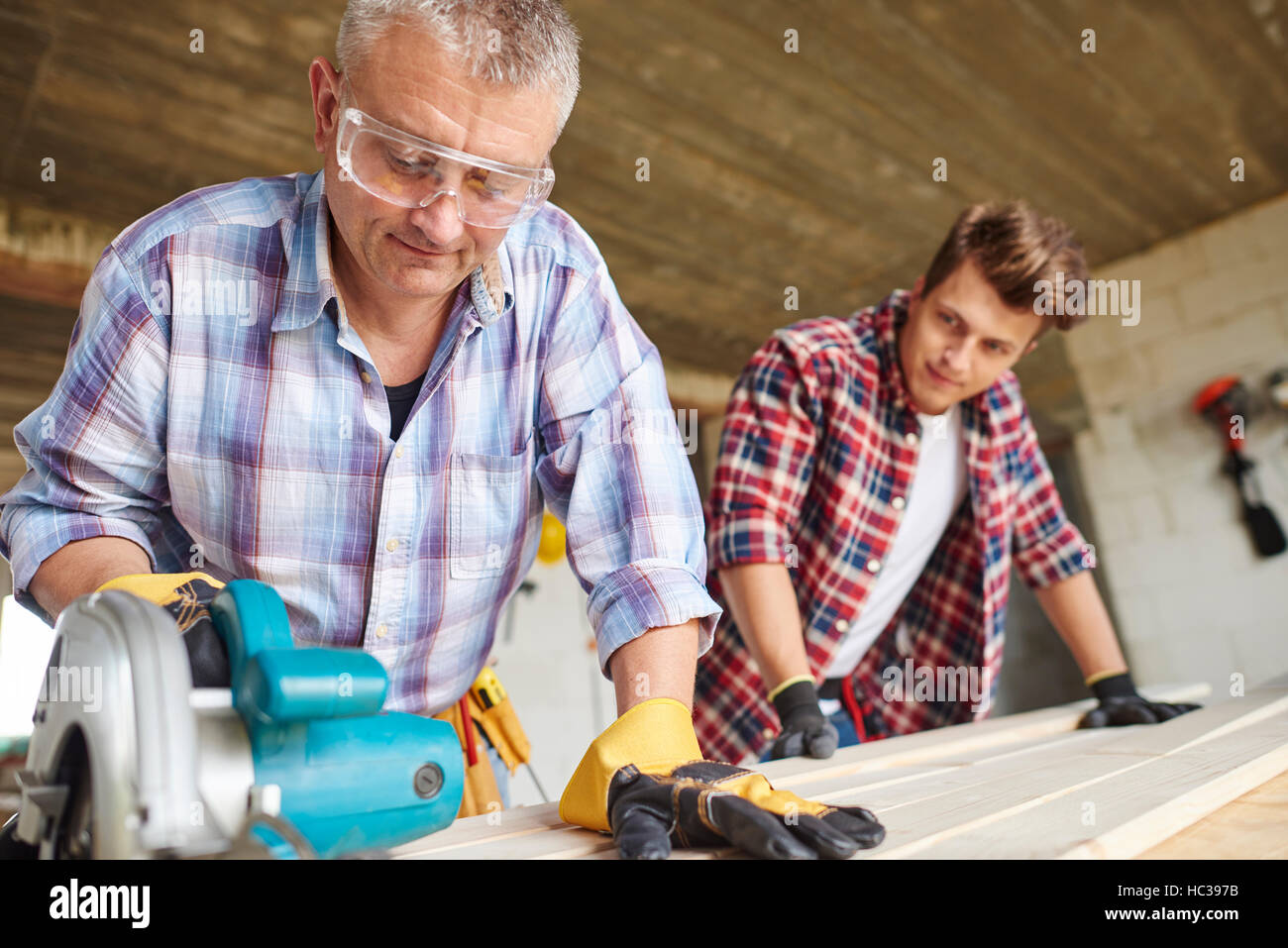 Experienced worker is clamping the wood Stock Photo - Alamy
