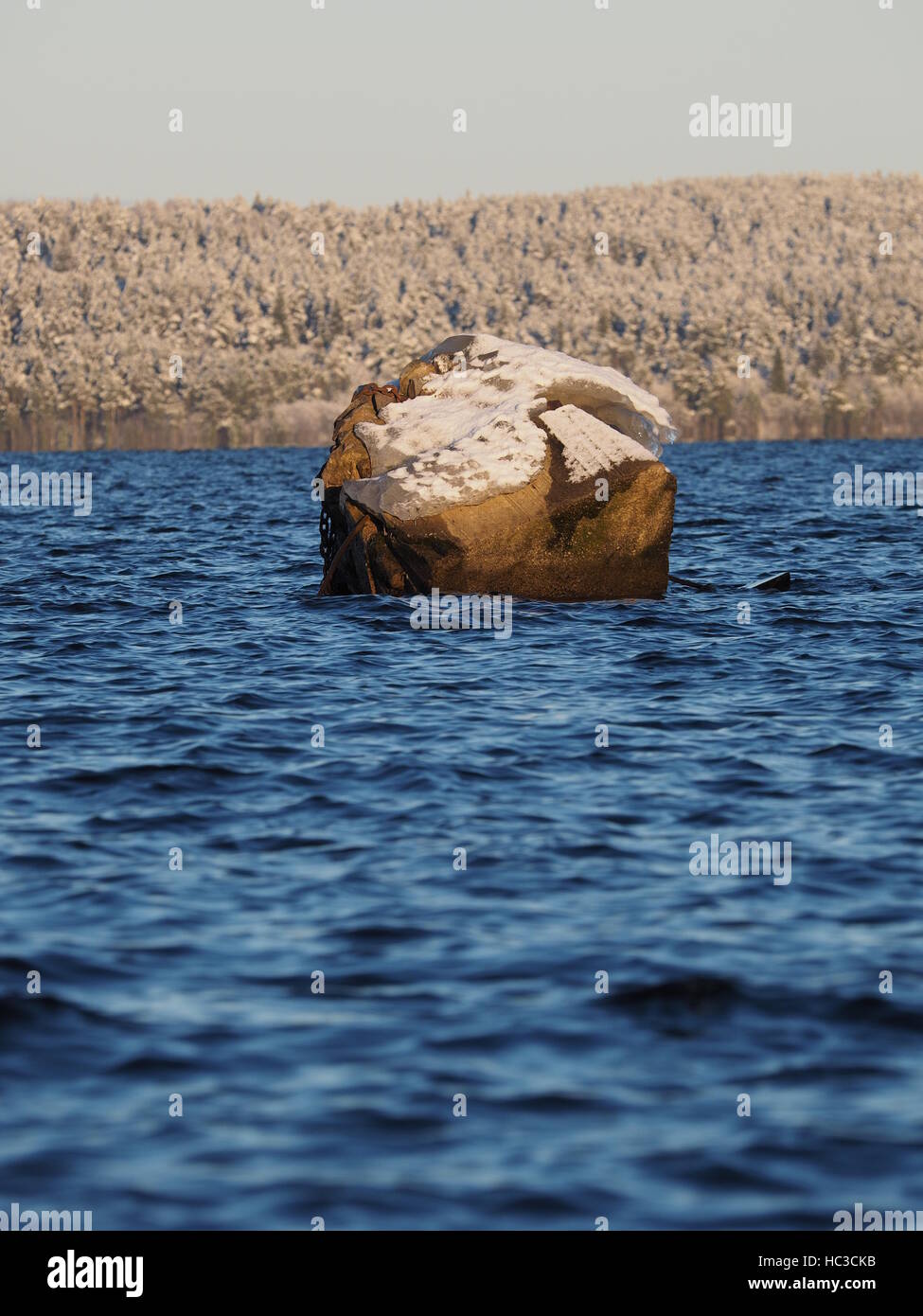 the frozen stone in the lake Stock Photo - Alamy