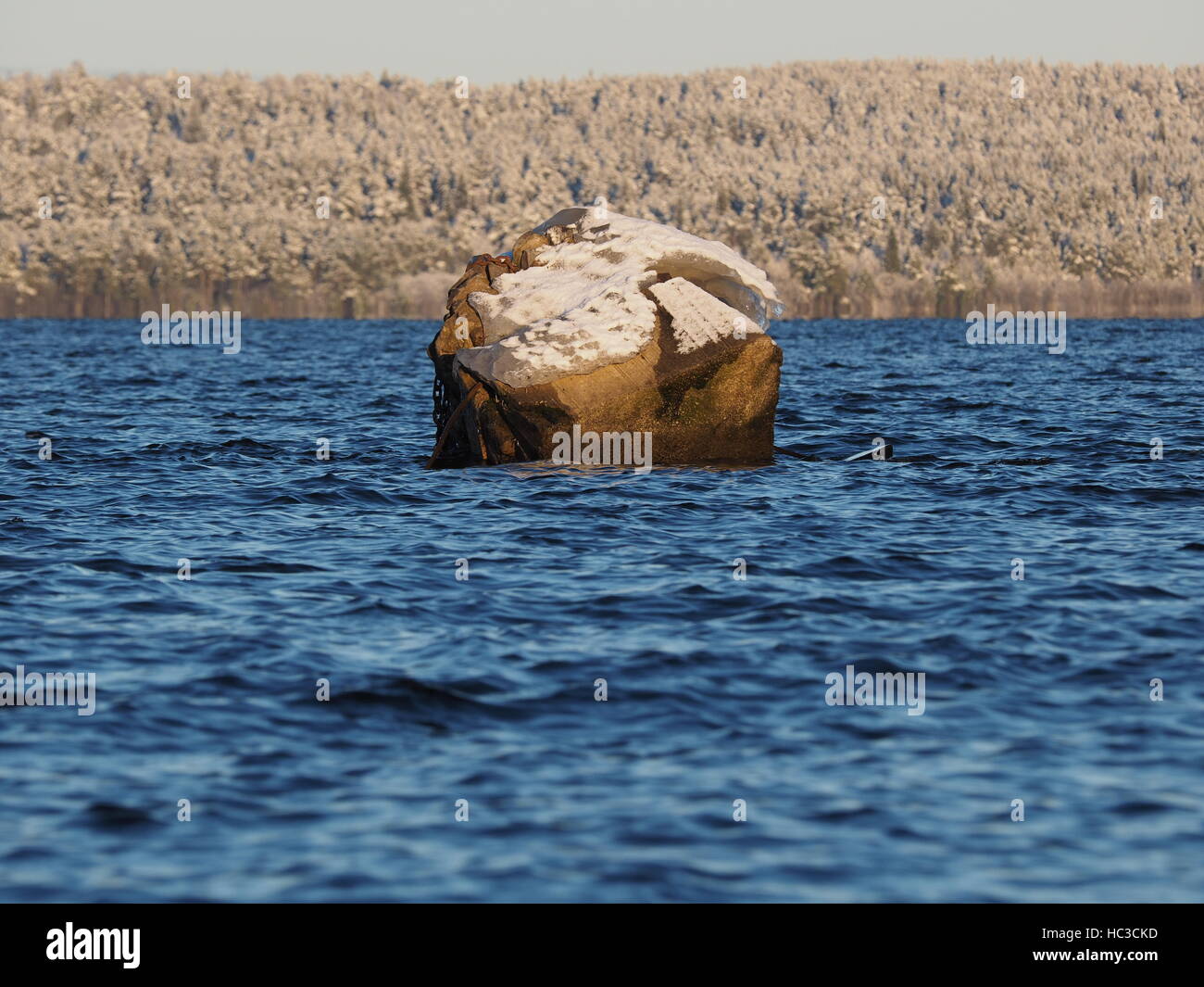 the frozen stone in the lake Stock Photo - Alamy