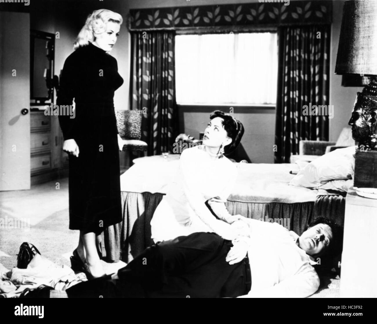ONE GIRL'S CONFESSION, from left: Cleo Moore, Helene Stanton, Hugo Haas ...