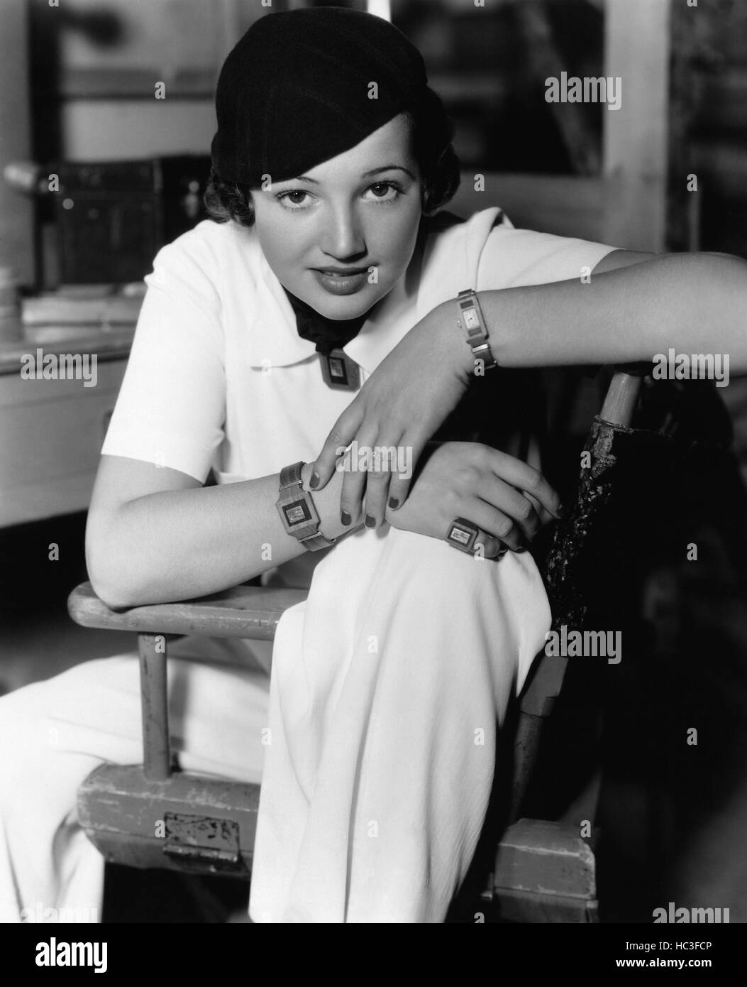 ONE HOUR LATE, Arline Judge, on-set, showing off her wooden bracelet ...