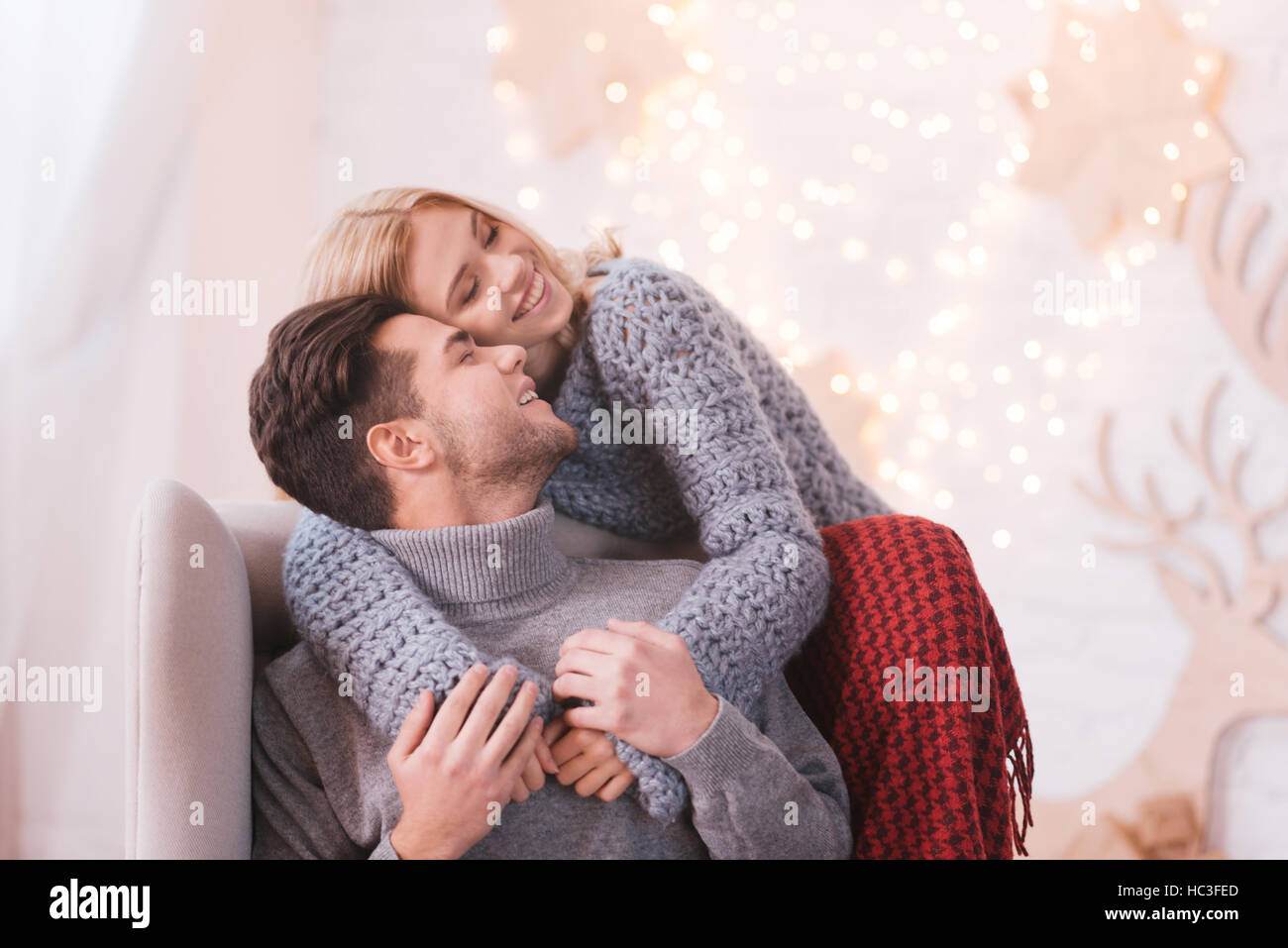 Beautiful happy woman hugging her boyfriend Stock Photo - Alamy
