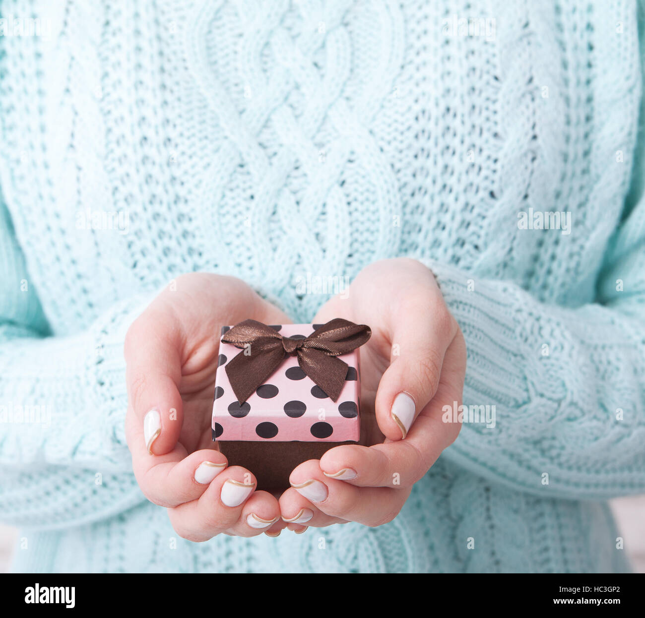 Present. Gift box. Woman holding small gift box with ribbon Stock Photo ...