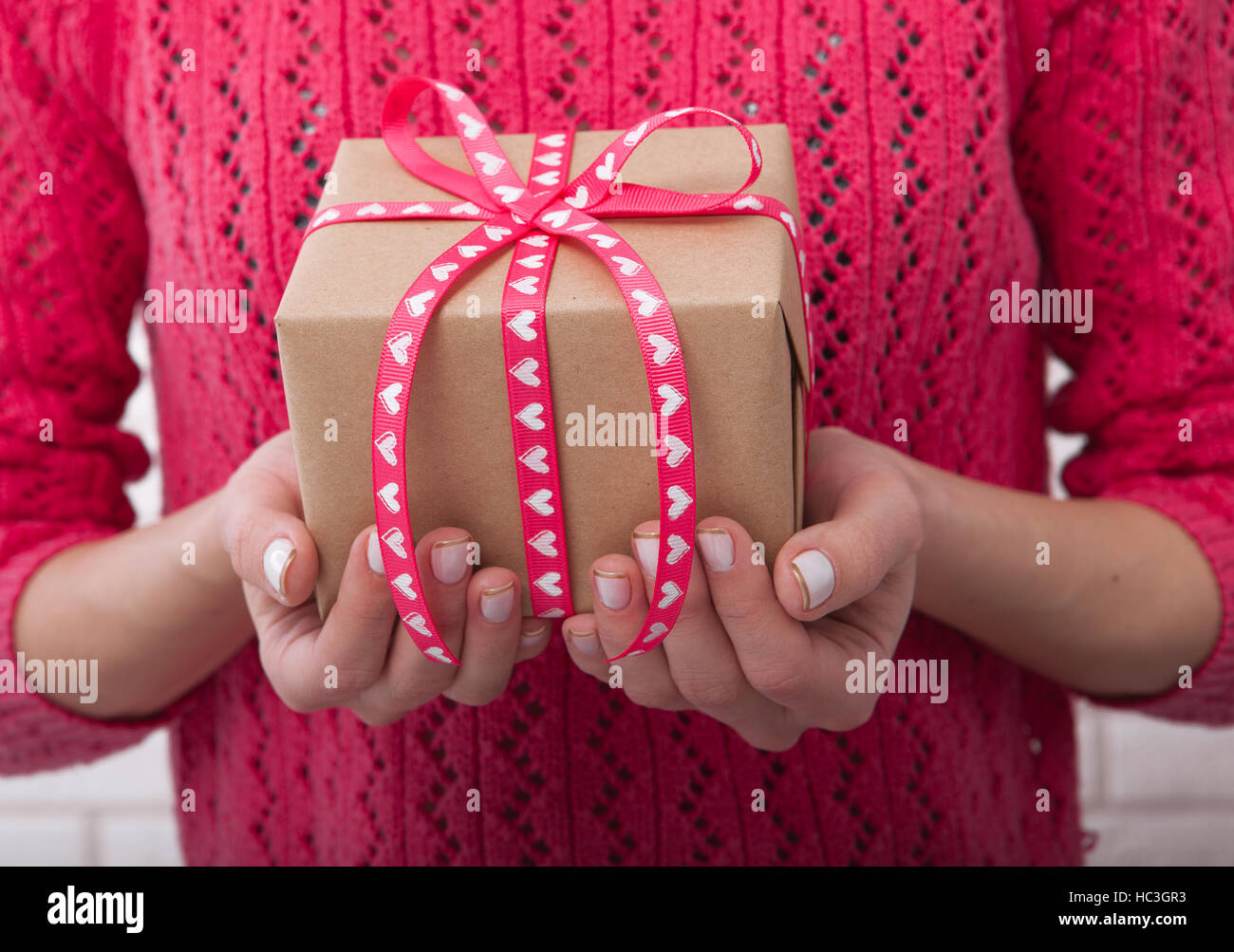 Present. Gift bos. Woman holding small gift box with ribbon Stock Photo ...