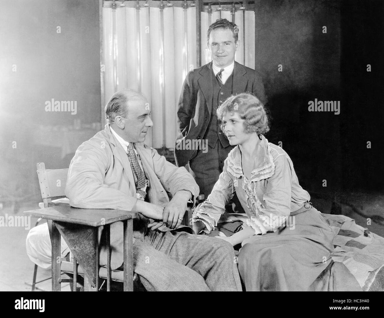 THE PASSIONATE ADVENTURE, front: director Graham Cutts, Marjorie Daw ...