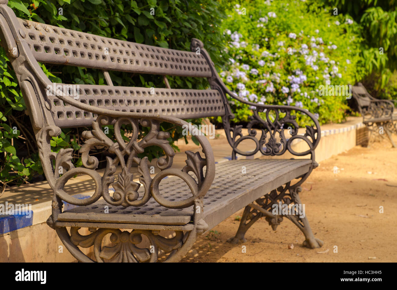 a lonely bench in a park in the middle of spring Stock Photo - Alamy