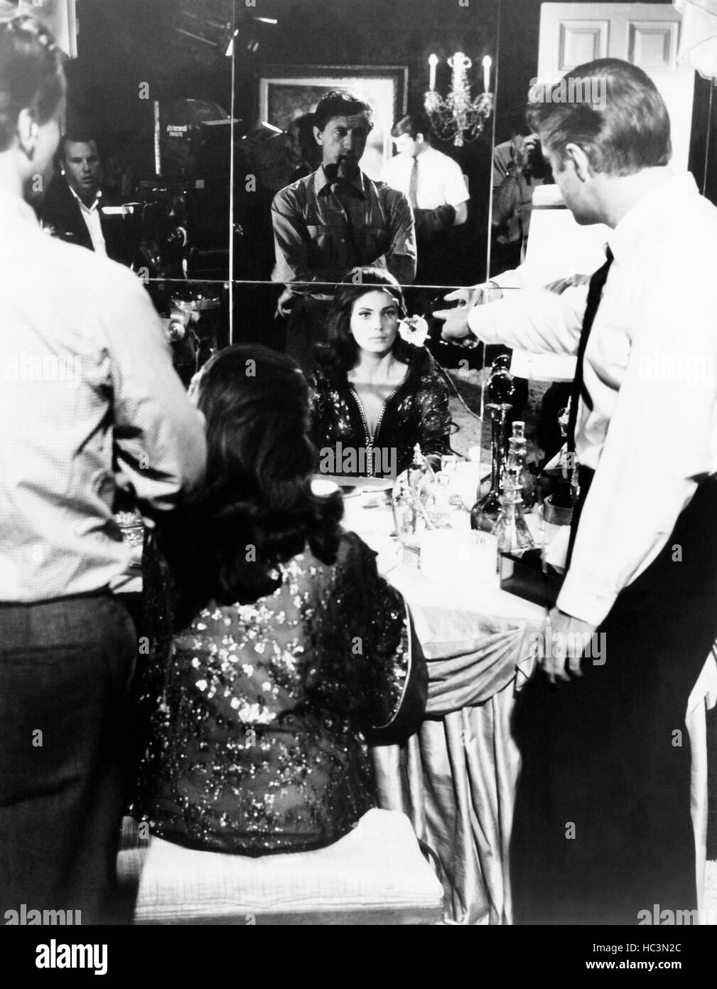 P.J., director John Guillermin (pipe), Gayle Hunnicutt (seated), George ...