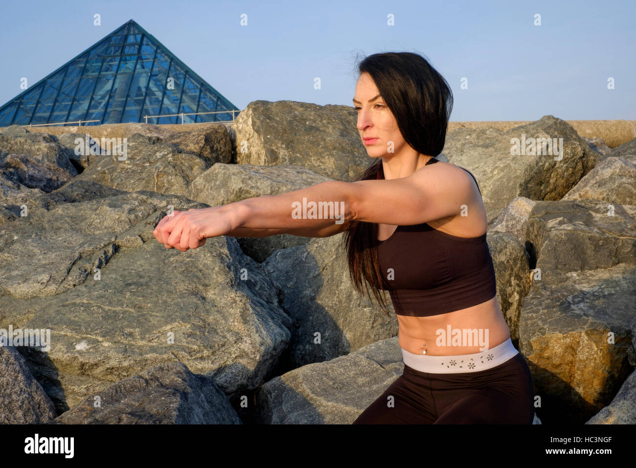 a young female exercising during her daily keep fit routine outdoors ...