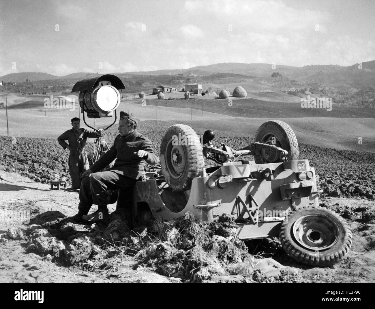 PRIVATE ANGELO, Peter Ustinov, between scenes, on location, Italy, 1949 ...
