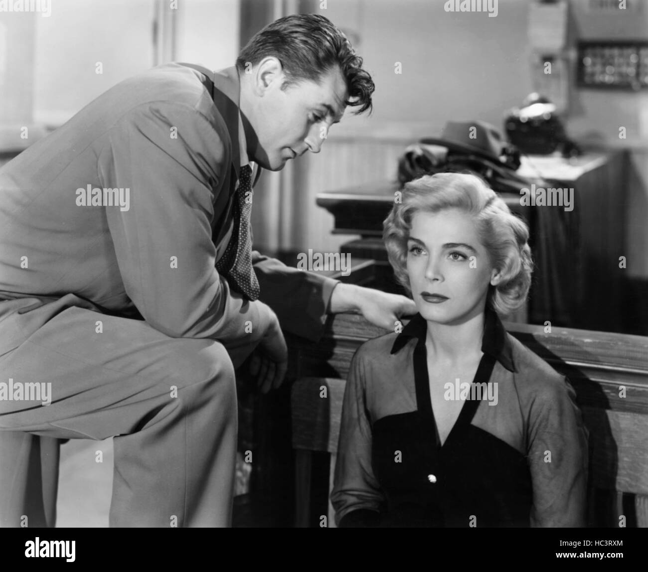 THE RACKET, from left: Robert Mitchum, Lizabeth Scott, 1951 Stock Photo ...
