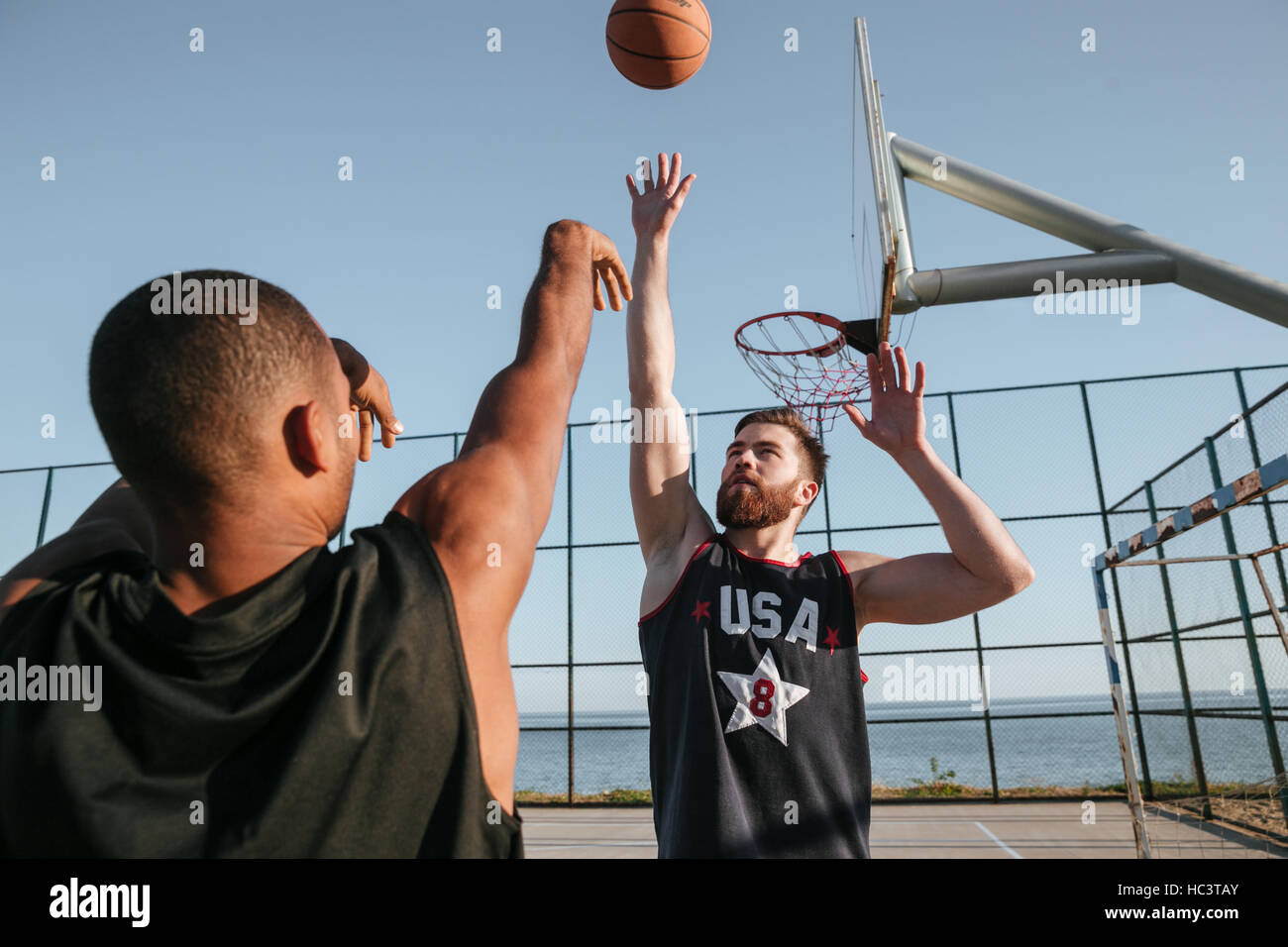 Two healthy basketball players at the playground outdoors Stock Photo ...