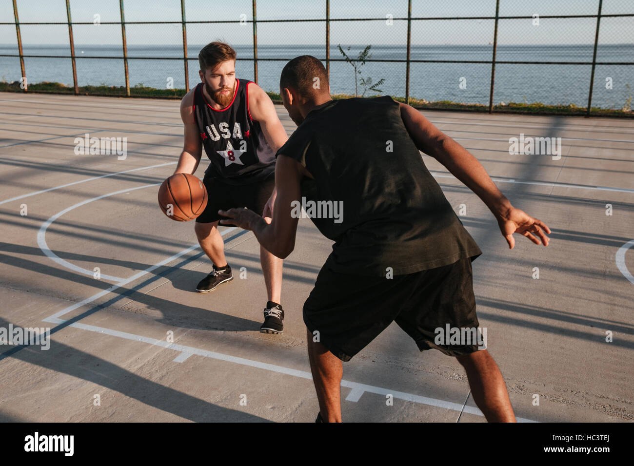 Two young men basketball hi-res stock photography and images - Alamy