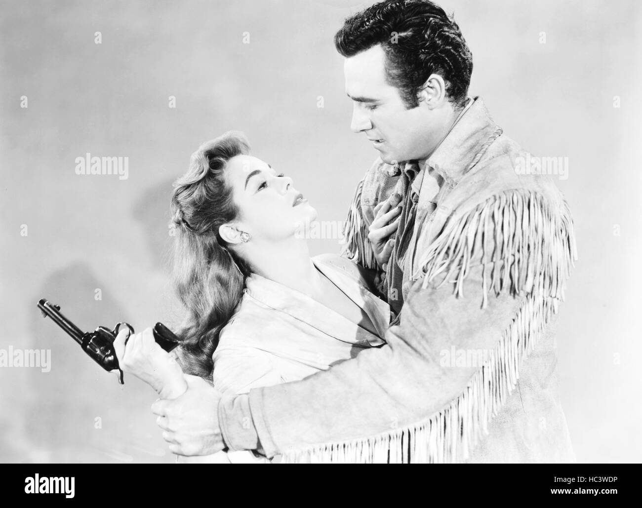 THE RAWHIDE TRAIL, from left: Nancy Gates, Rex Reason, 1958 Stock Photo ...