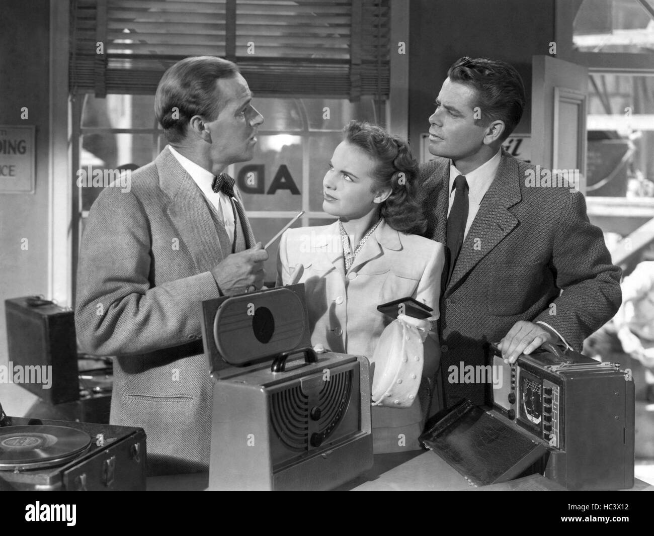 THE RETURN OF OCTOBER, from left: Arthur Space, Terry Moore, Glenn Ford ...
