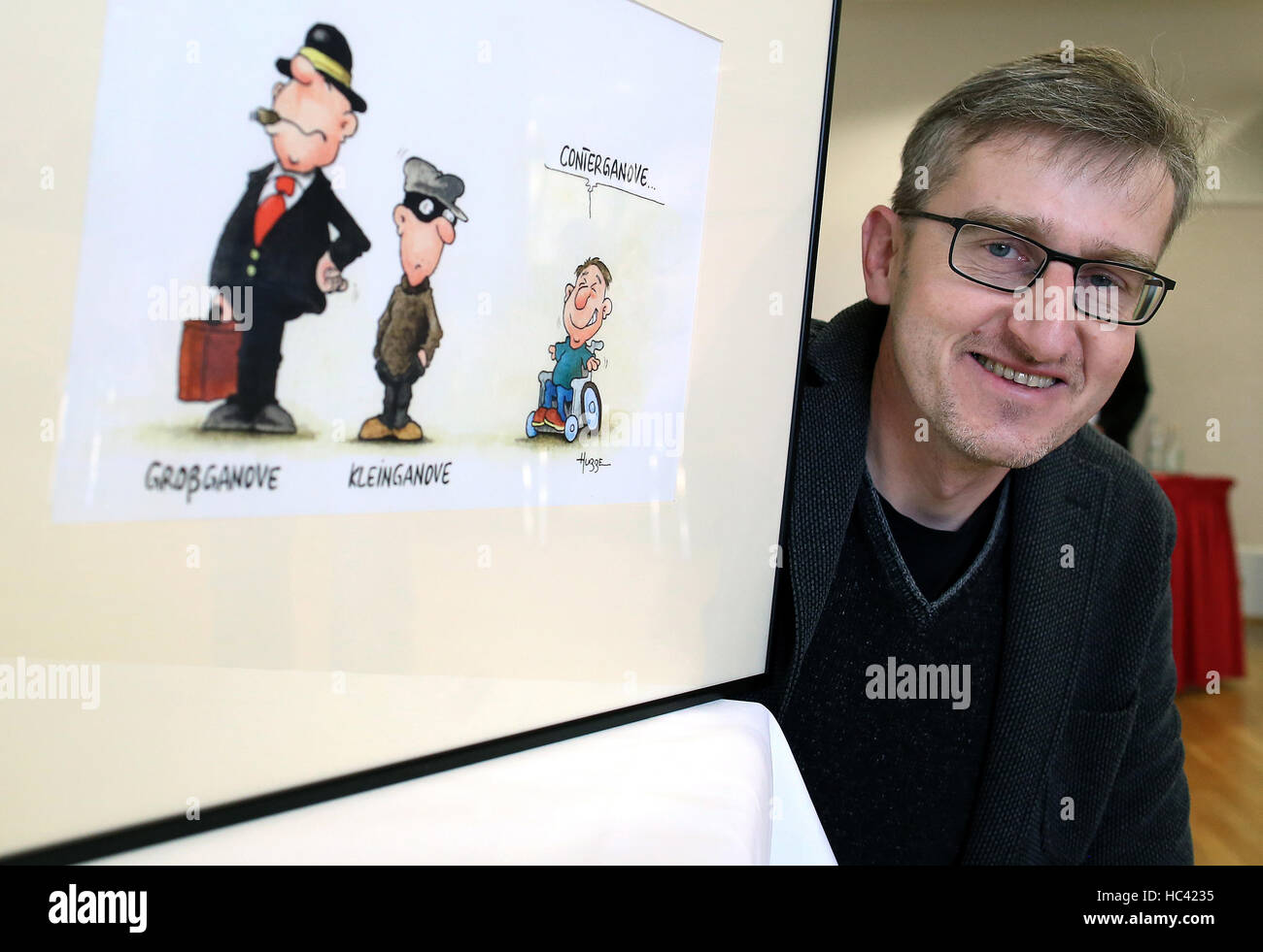 Magdeburg, Germany. 7th Dec, 2016. The cartoonist Phil Hubbe stands ...