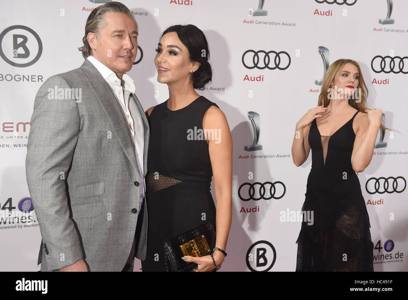 Munich, Germany. 7th Dec, 2016. Verona (c) and Franjo Pooth arrive for ...