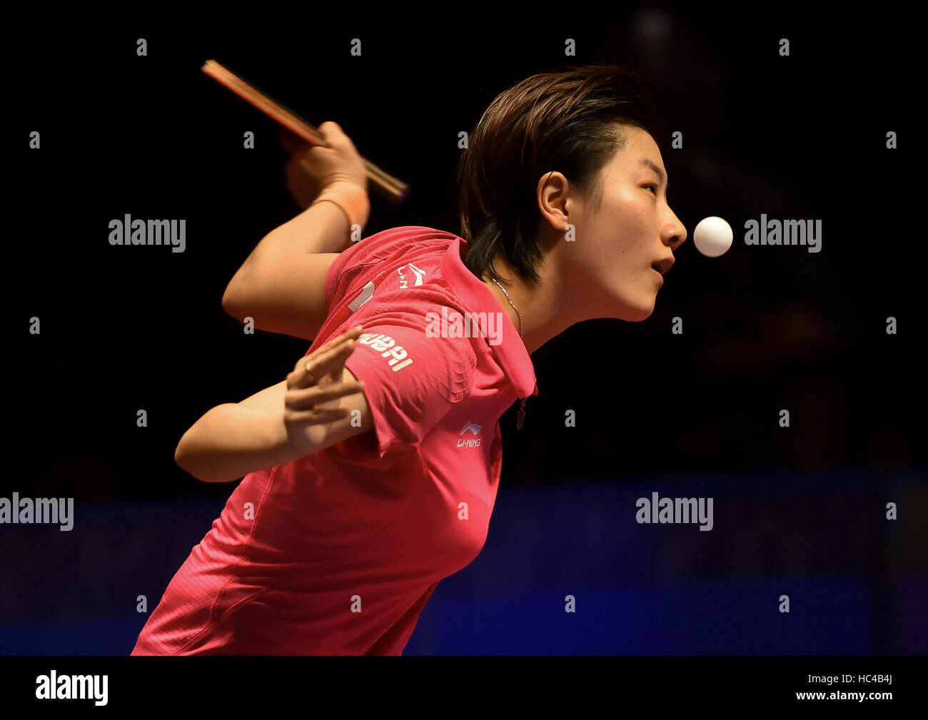 Doha, Qatar. 8th Dec, 2016. Ding Ning of China serves to Lee Ho Ching ...