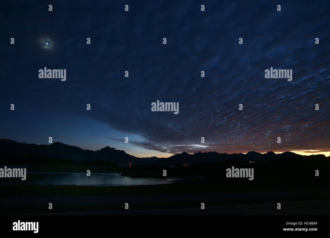 Bavaria, Germany. 07th Dec, 2016. The moon in a cloudy night sky in ...