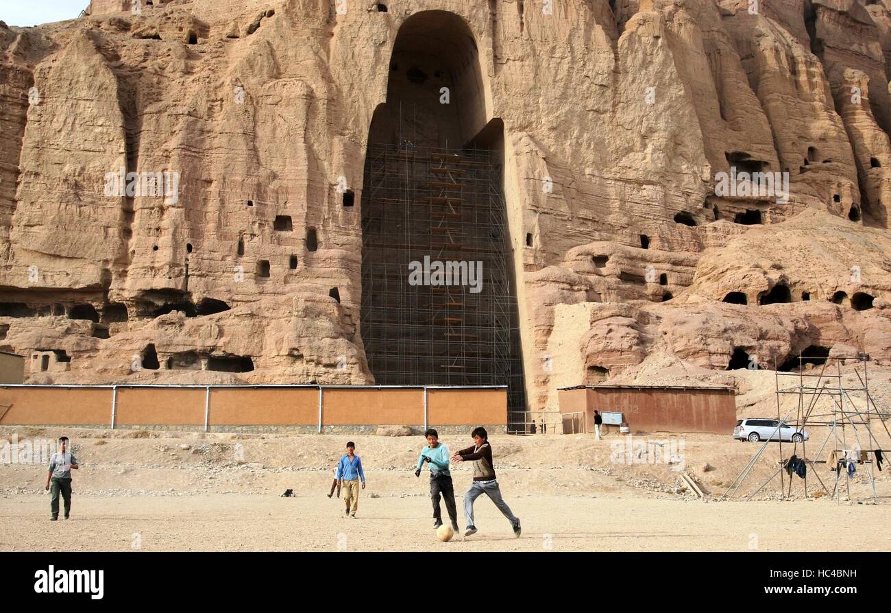 Bamyan. 8th Dec, 2016. Afghan children play football in front of the ...