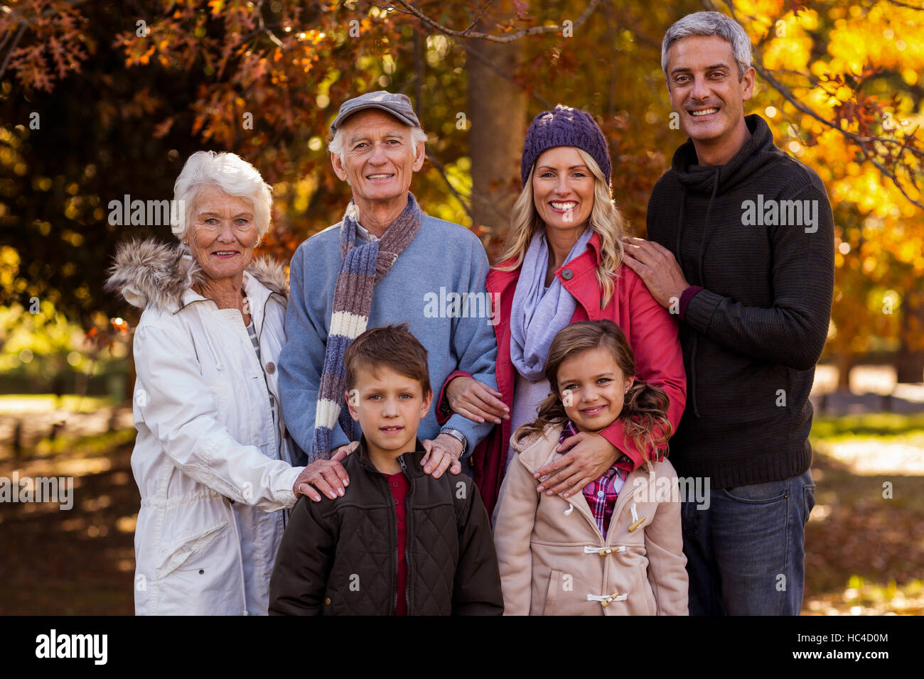 Portrait of multi-generation family standing at park Stock Photo - Alamy