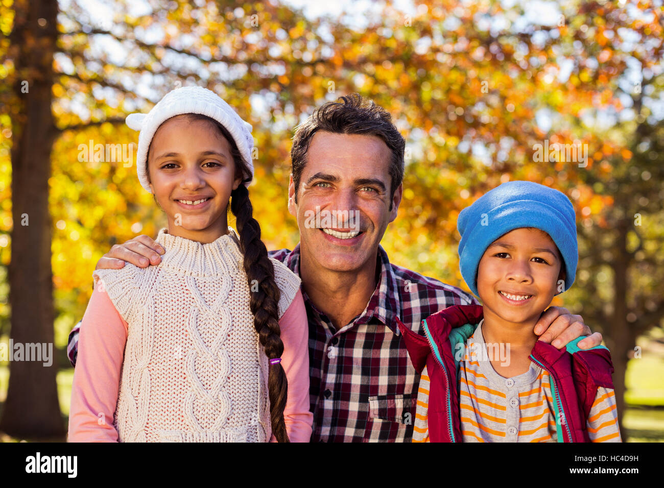 Happy father with son and daughter at park Stock Photo - Alamy