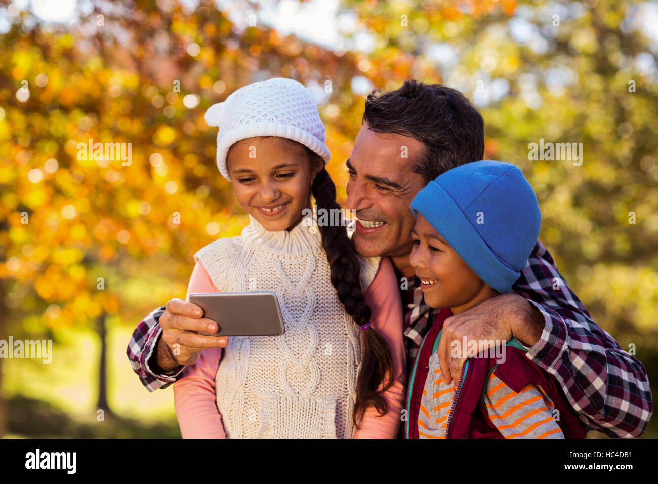 Children looking cellphone park two hi-res stock photography and images ...