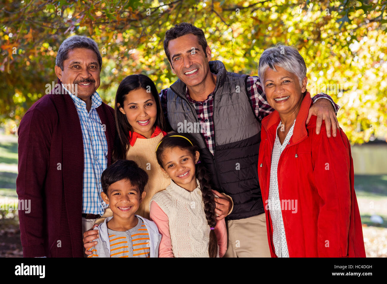Portrait of smiling multi-generation family at park Stock Photo - Alamy