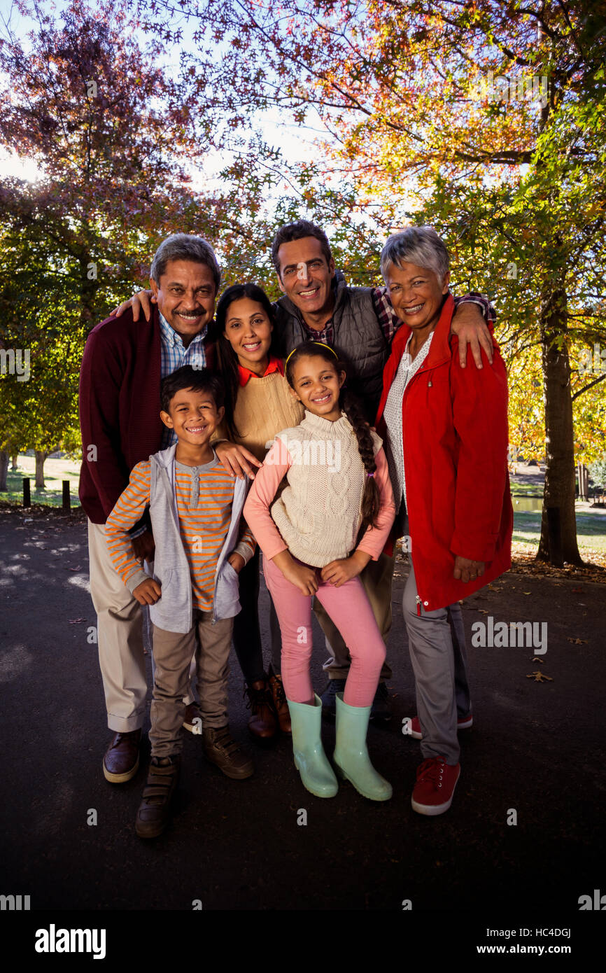 Full length of multi-generation family standing at park Stock Photo - Alamy