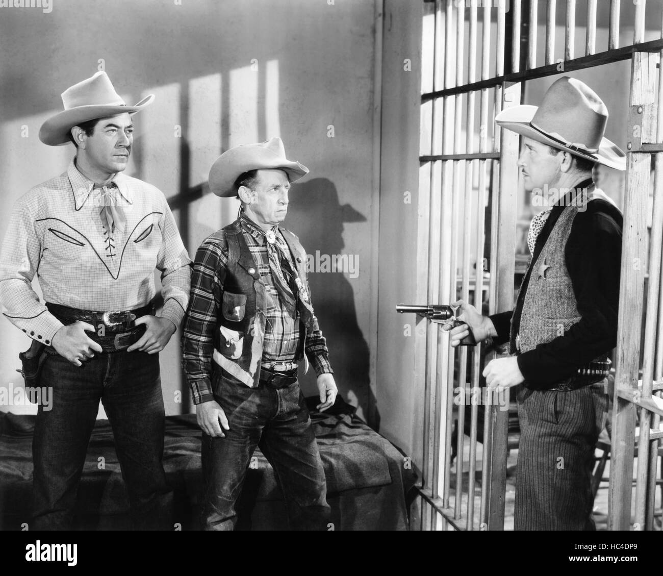 PARTNERS OF THE TRAIL, from left, Johnny Mack Brown, Raymond Hatton ...