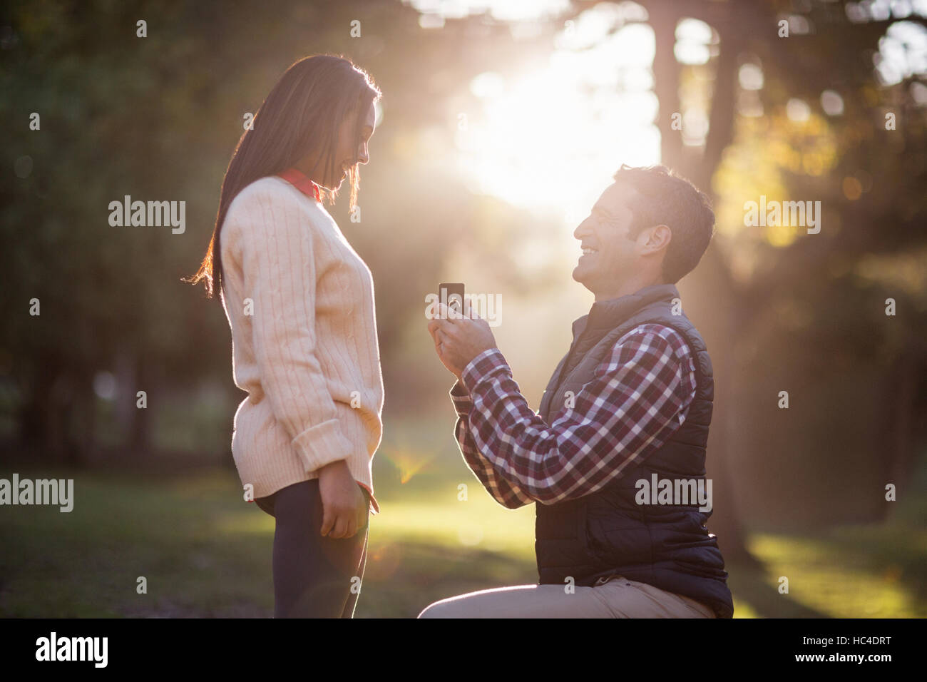 Man giving ring to woman Stock Photo - Alamy