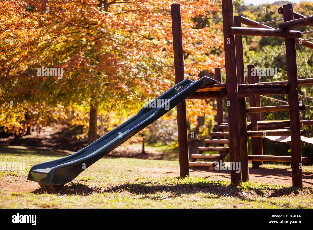 Slide at park during autumn Stock Photo - Alamy