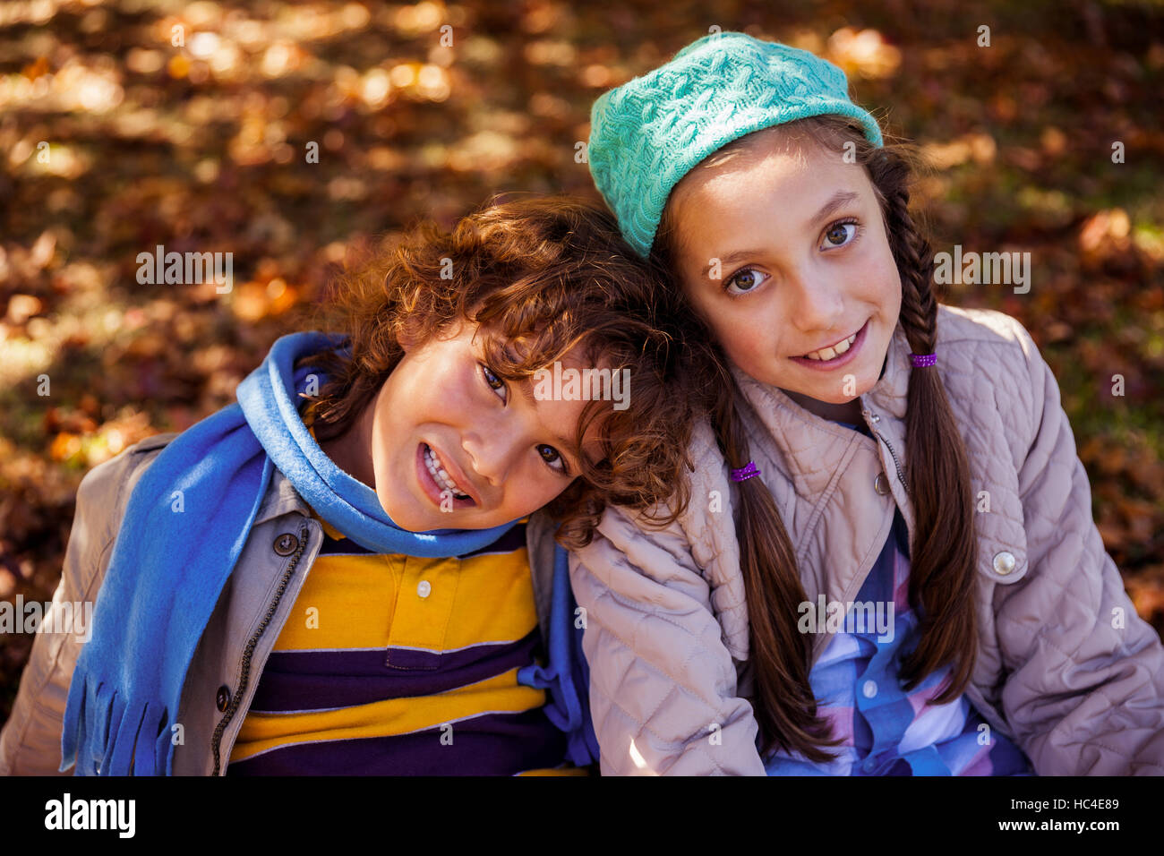 Portrait of smiling siblings Stock Photo - Alamy