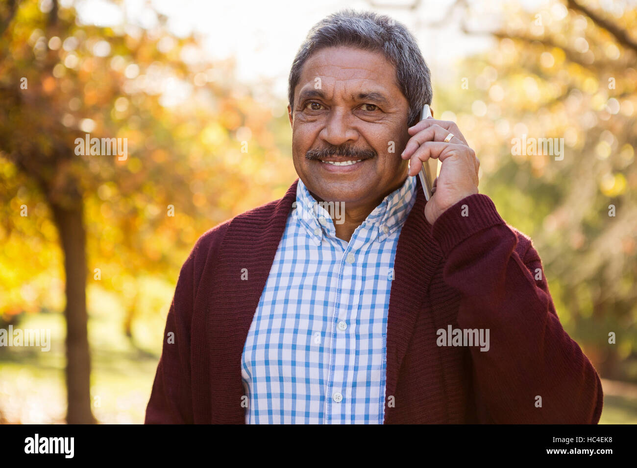 Mature man talking mobile phone hi-res stock photography and images - Alamy