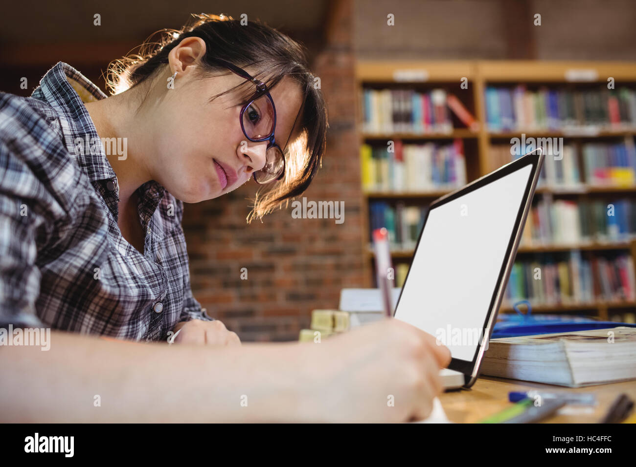 Beautiful female student writing sitting hi-res stock photography and ...