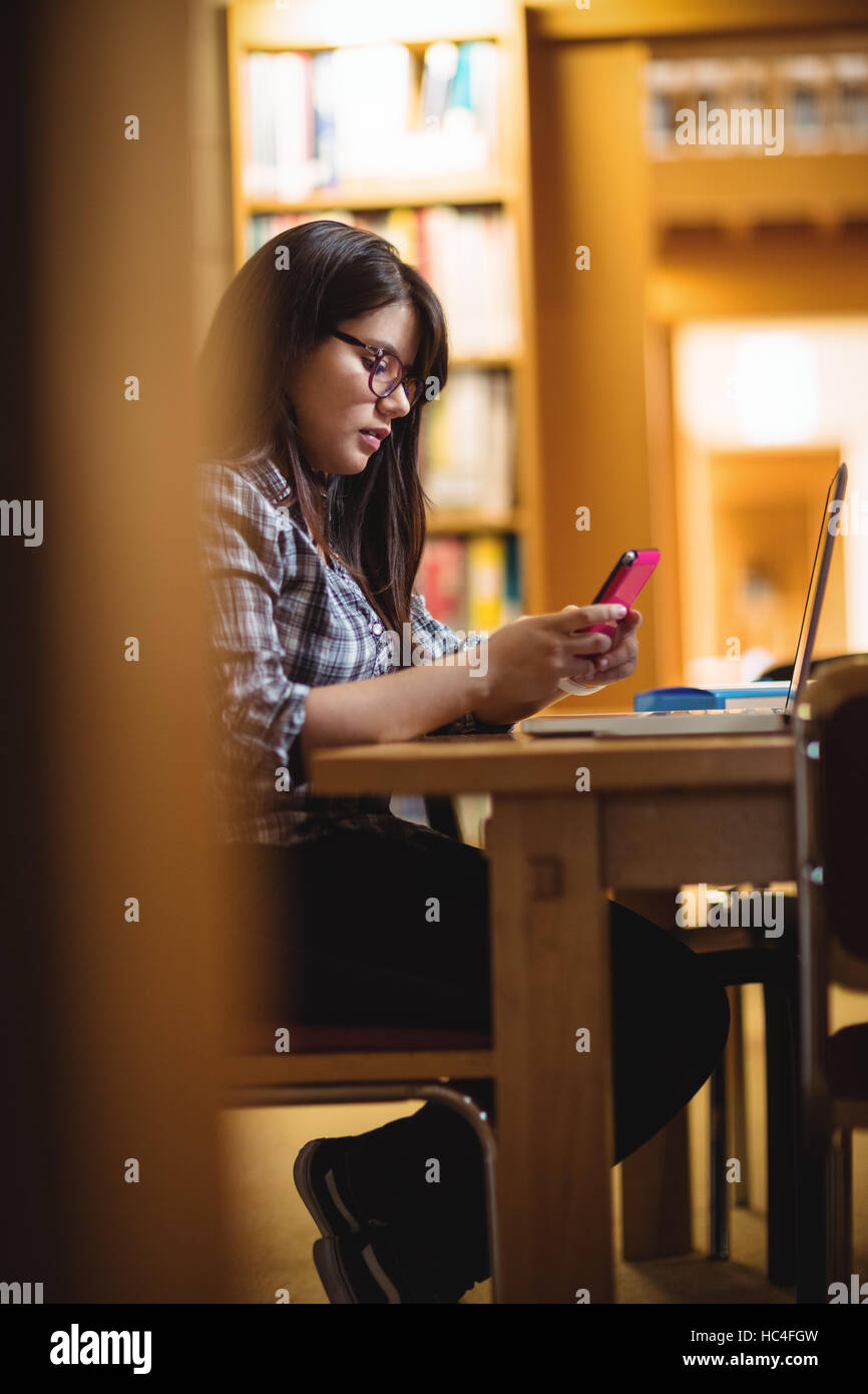 Female student using mobile phone Stock Photo - Alamy