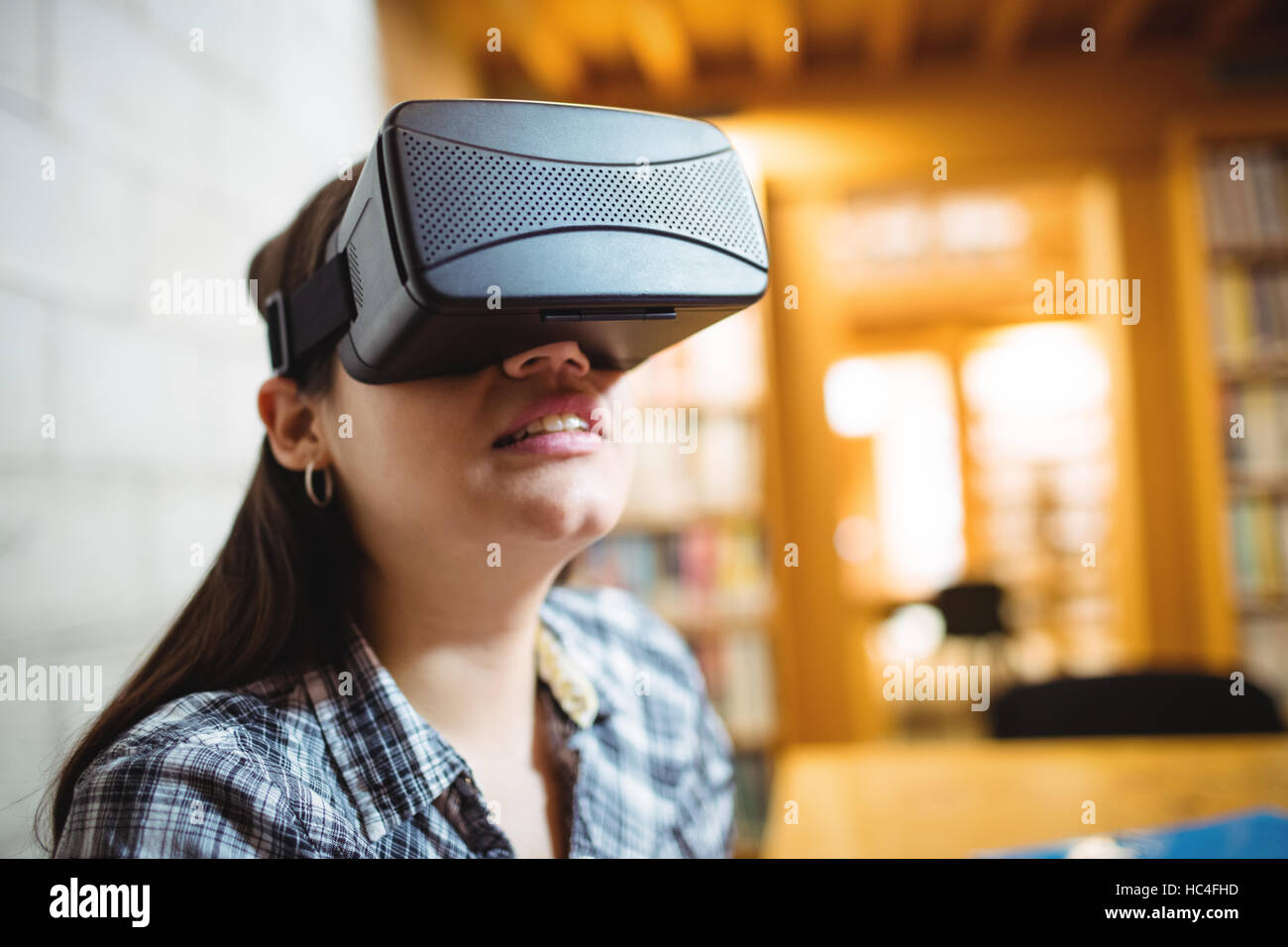 Female student using virtual reality headset Stock Photo - Alamy