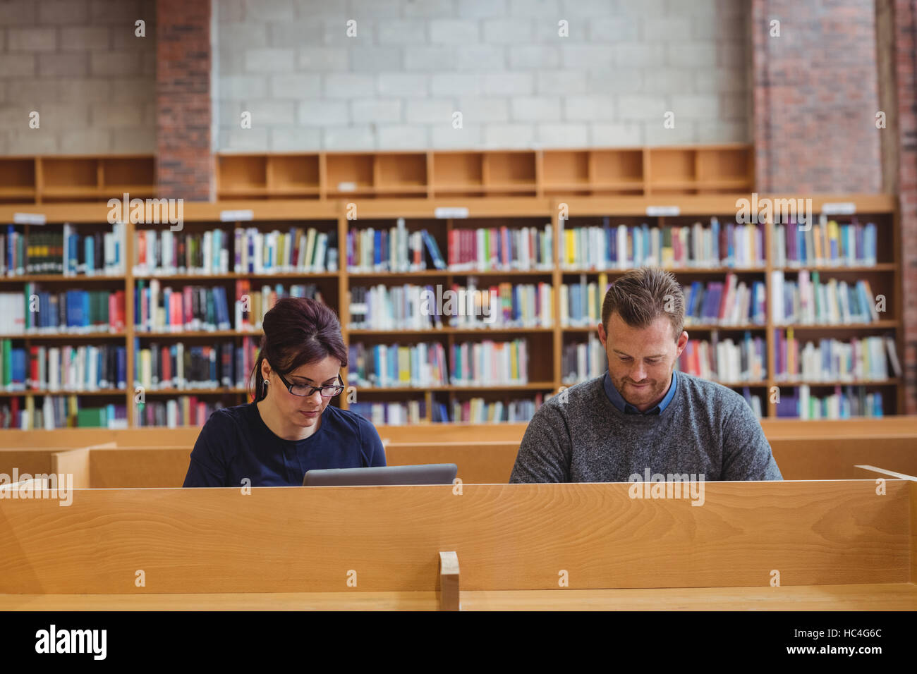 Mature students using laptop to help with studying Stock Photo - Alamy